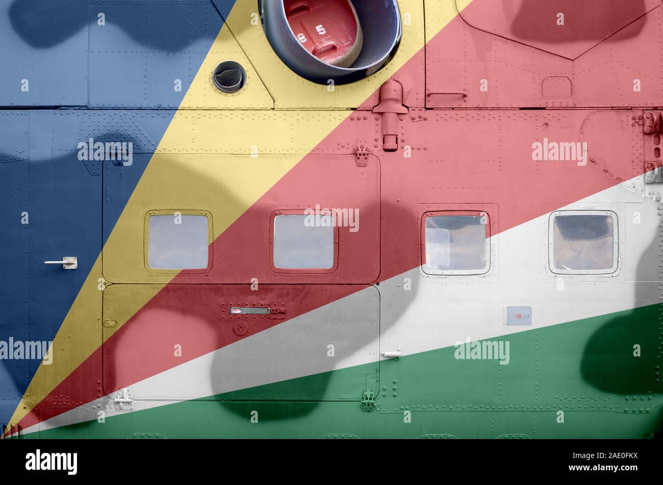 Seychelles flag depicted on side part of military armored helicopter ...