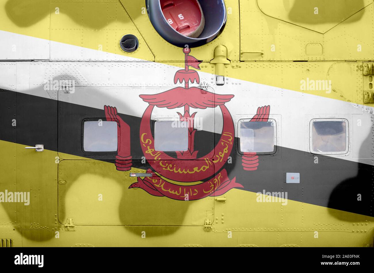 Brunei Darussalam flag depicted on side part of military armored ...