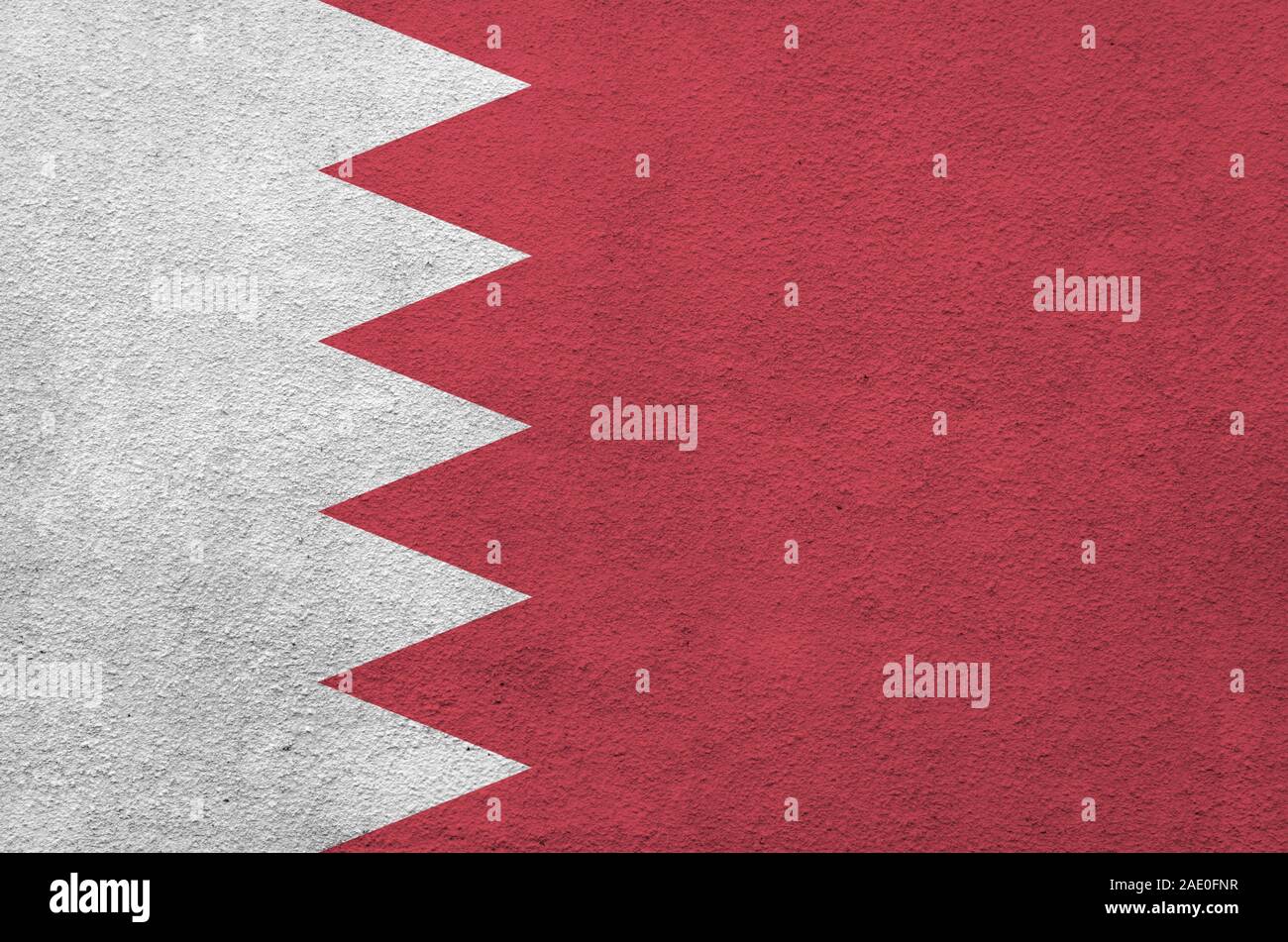 Bahrain flag depicted in bright paint colors on old relief plastering ...