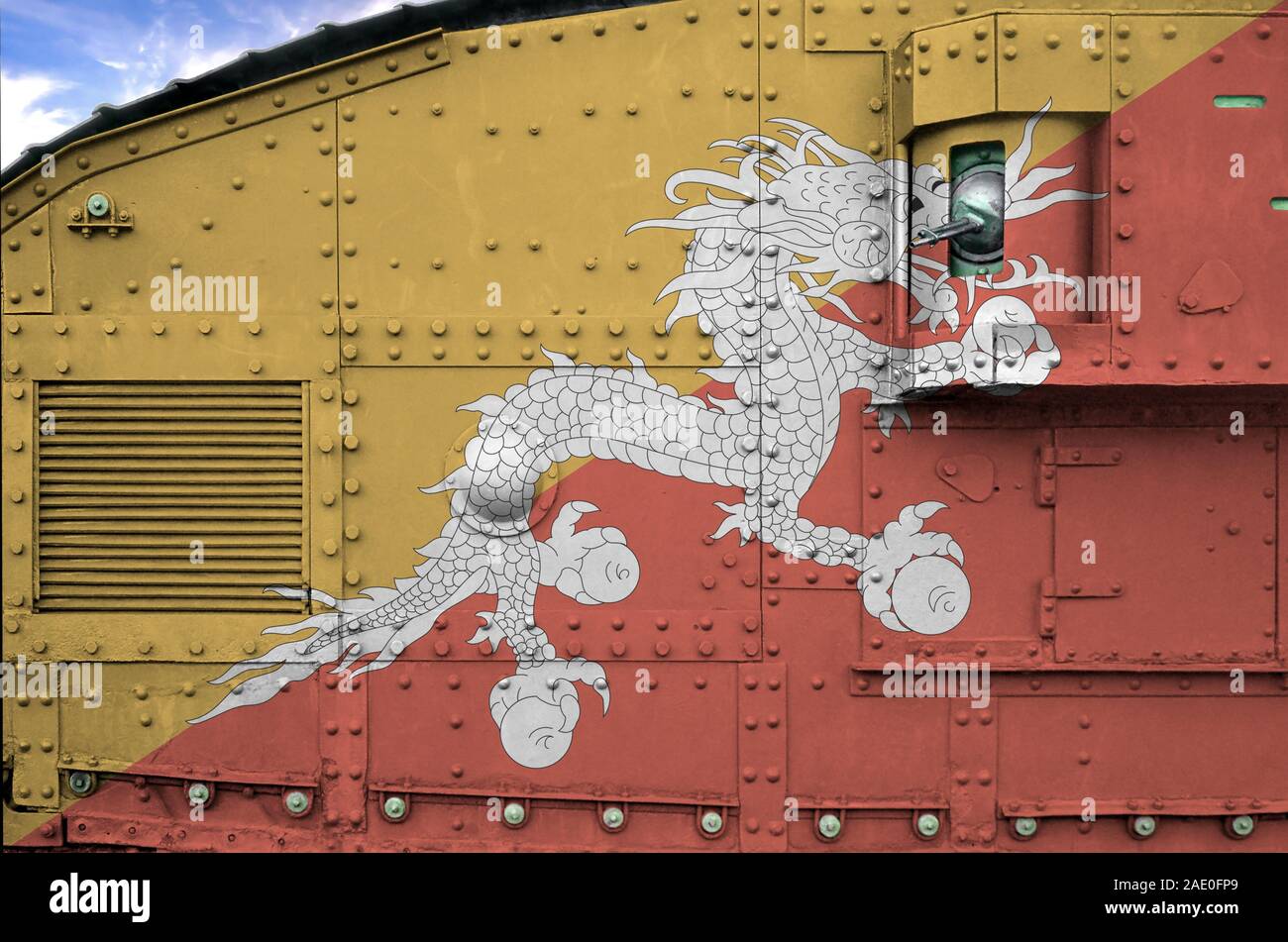 Bhutan flag depicted on side part of military armored tank close up ...
