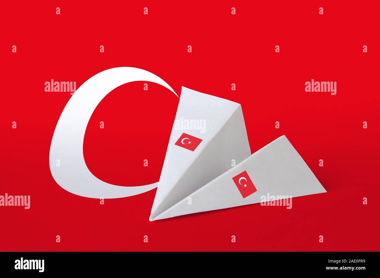 Turkey flag depicted on paper origami airplane. Oriental handmade arts ...