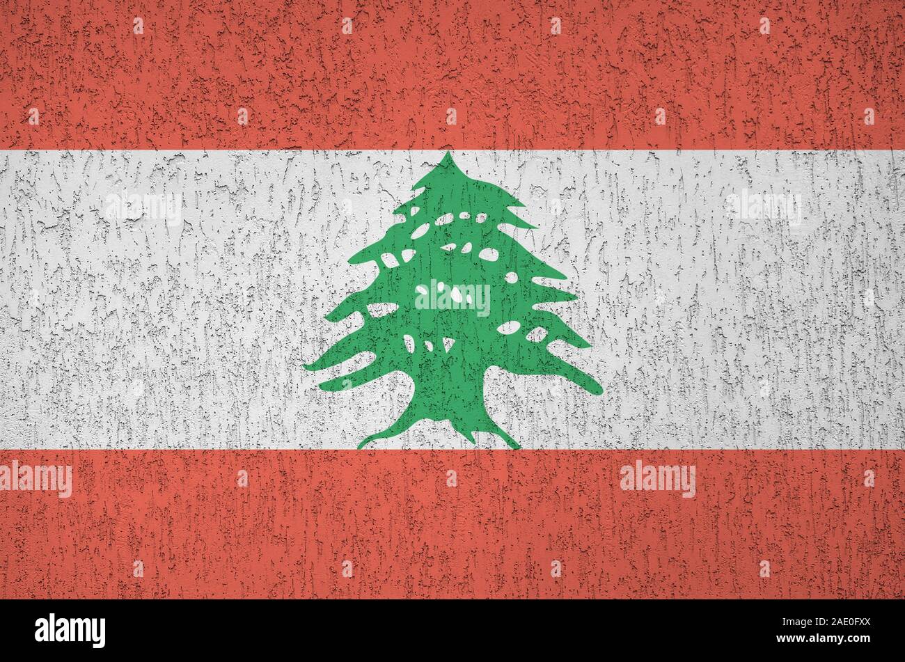 Lebanon flag depicted in bright paint colors on old relief plastering ...