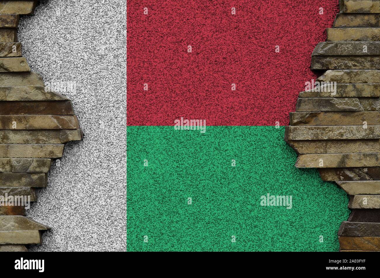Madagascar flag depicted in paint colors on old stone wall close up ...