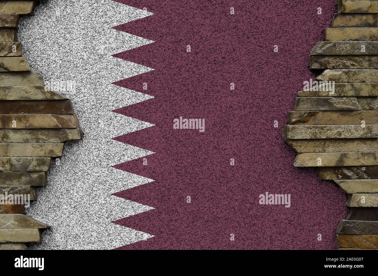 Qatar flag depicted in paint colors on old stone wall close up ...