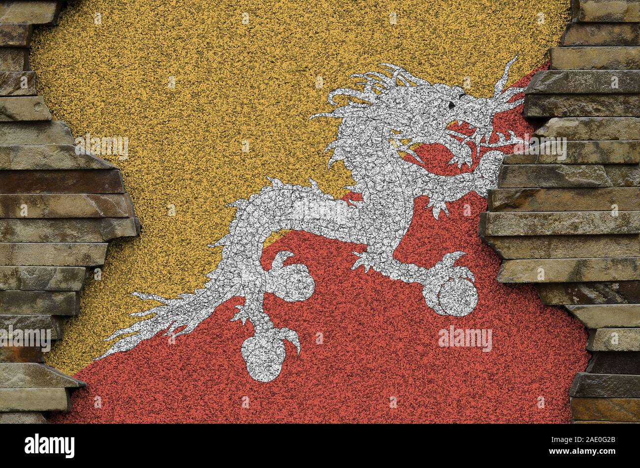 Bhutan flag depicted in paint colors on old stone wall close up ...