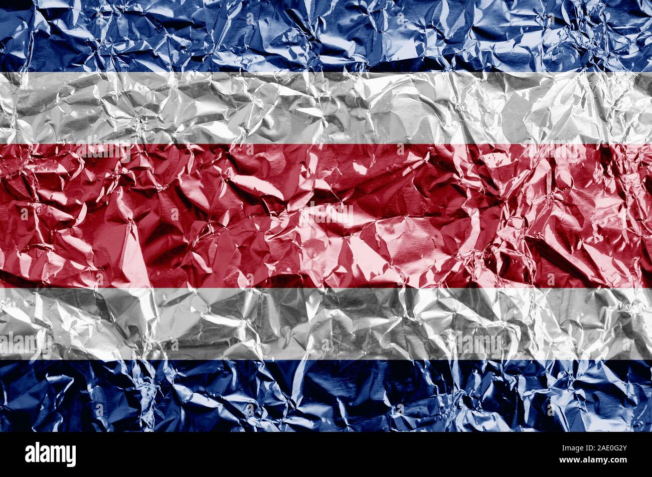 Costa Rica flag depicted in paint colors on shiny crumpled aluminium ...