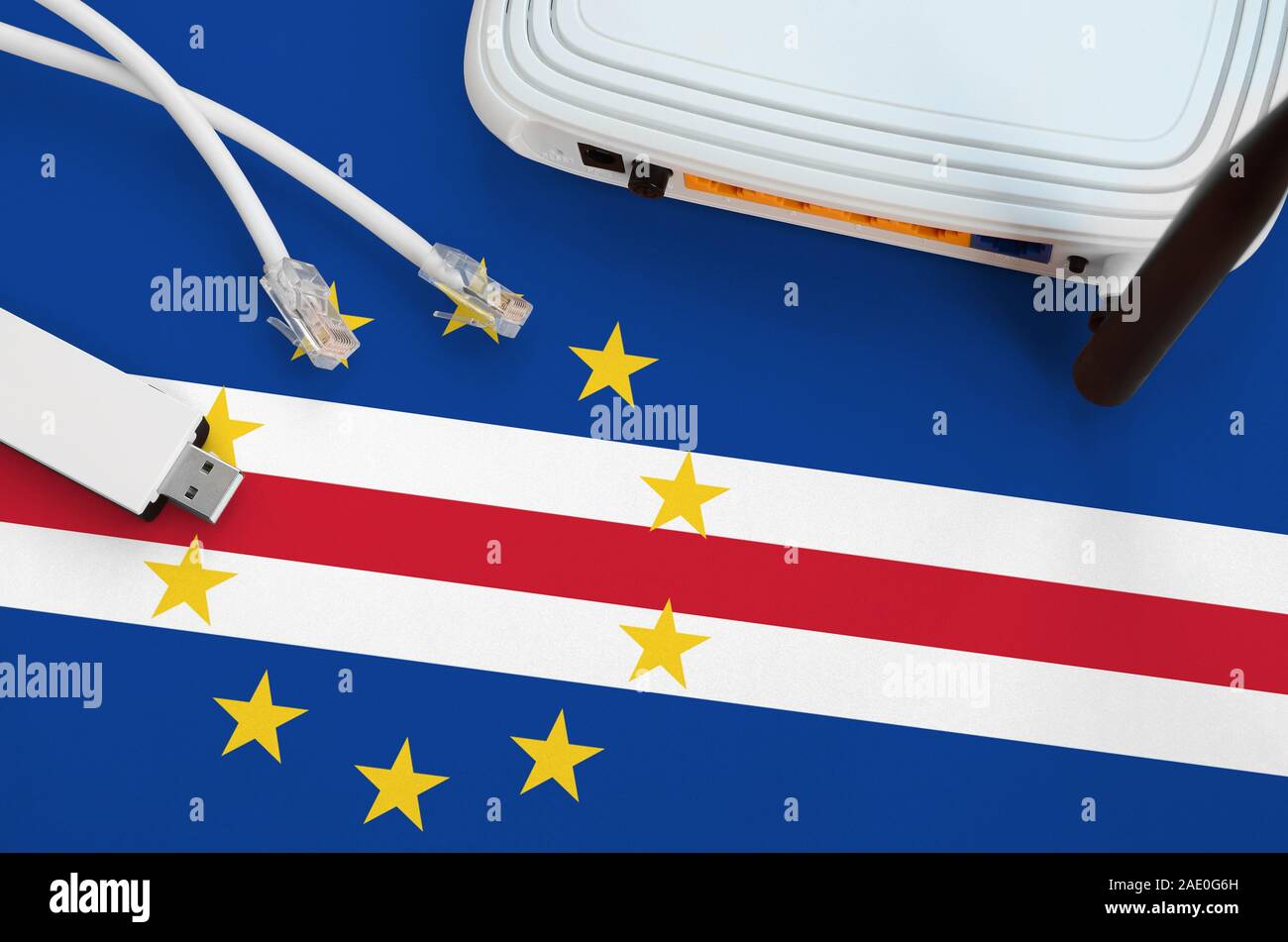 Cabo verde flag depicted on table with internet rj45 cable, wireless ...