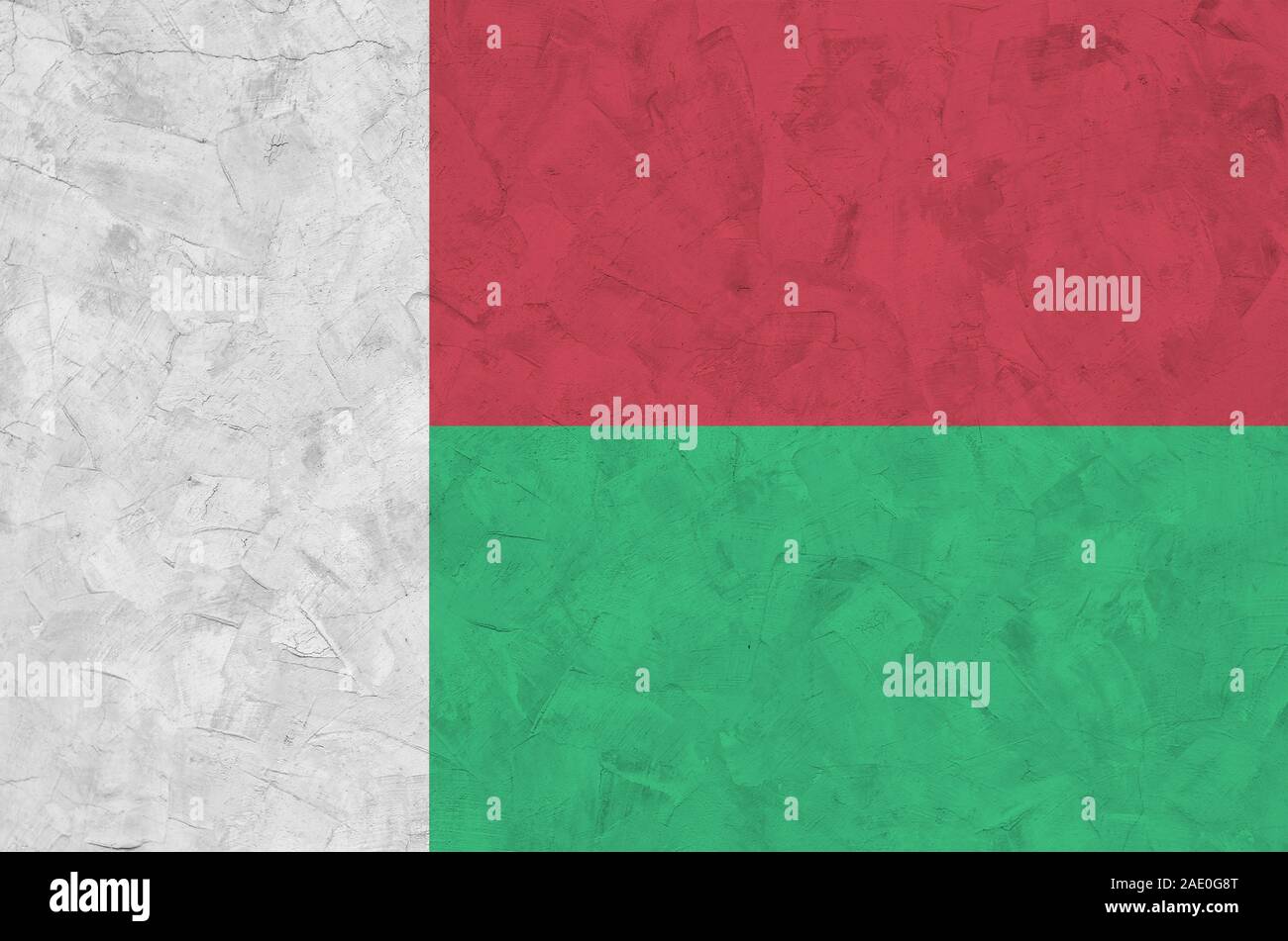 Madagascar flag depicted in bright paint colors on old relief ...