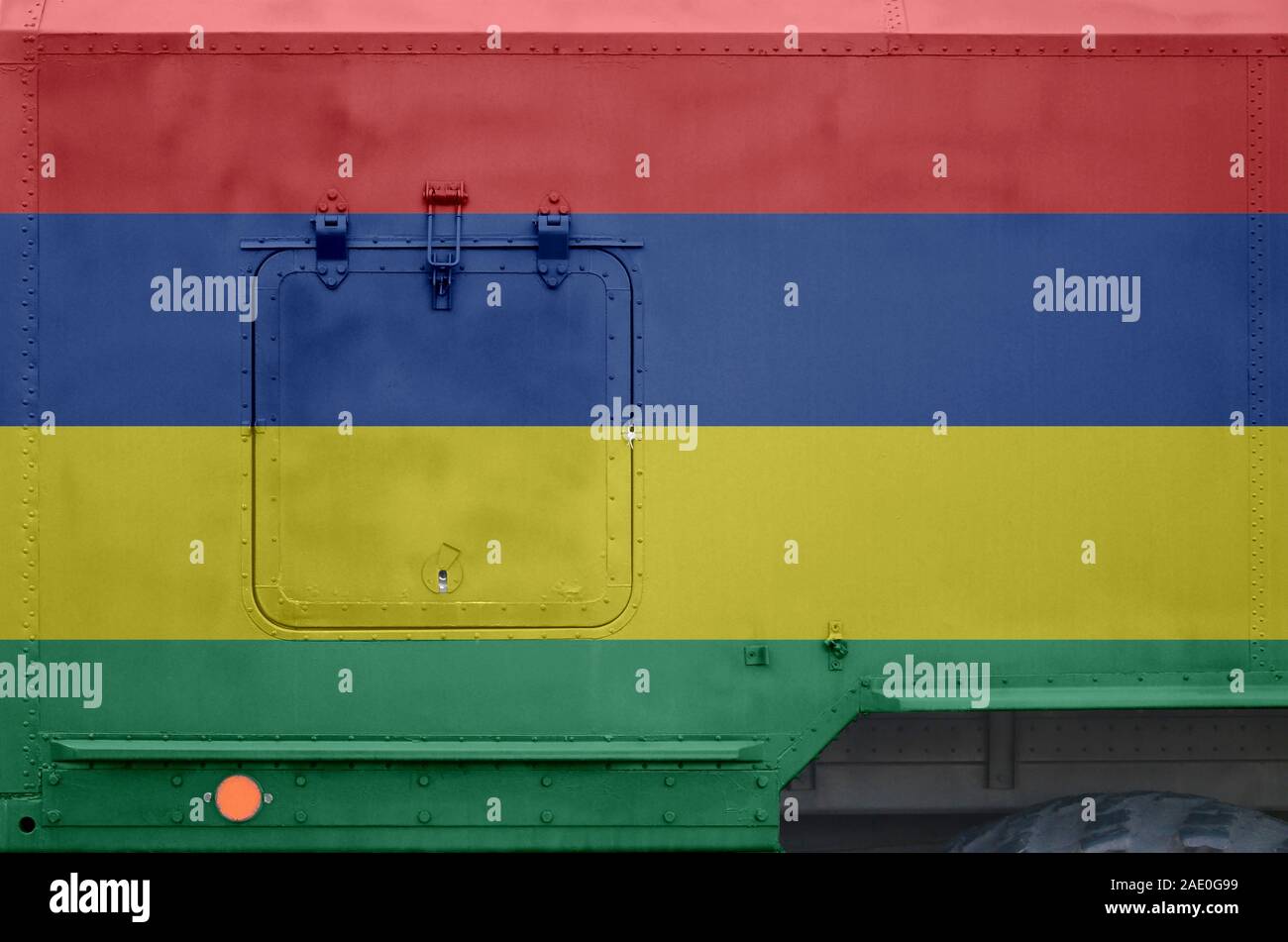 Mauritius flag depicted on side part of military armored truck close up ...