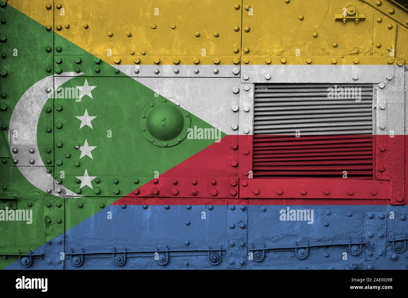 Comoros flag depicted on side part of military armored tank close up ...