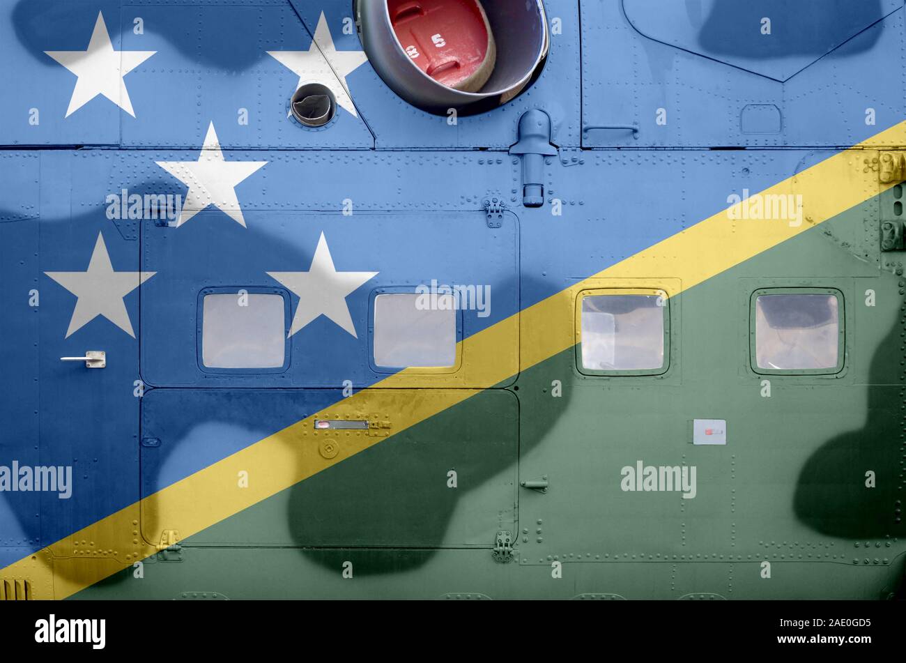 Solomon Islands flag depicted on side part of military armored ...