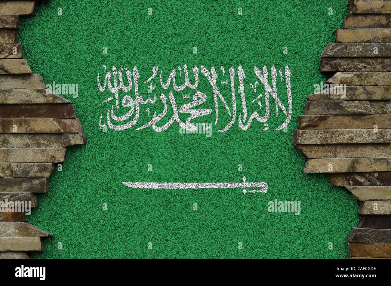 Saudi Arabia flag depicted in paint colors on old stone wall close up ...