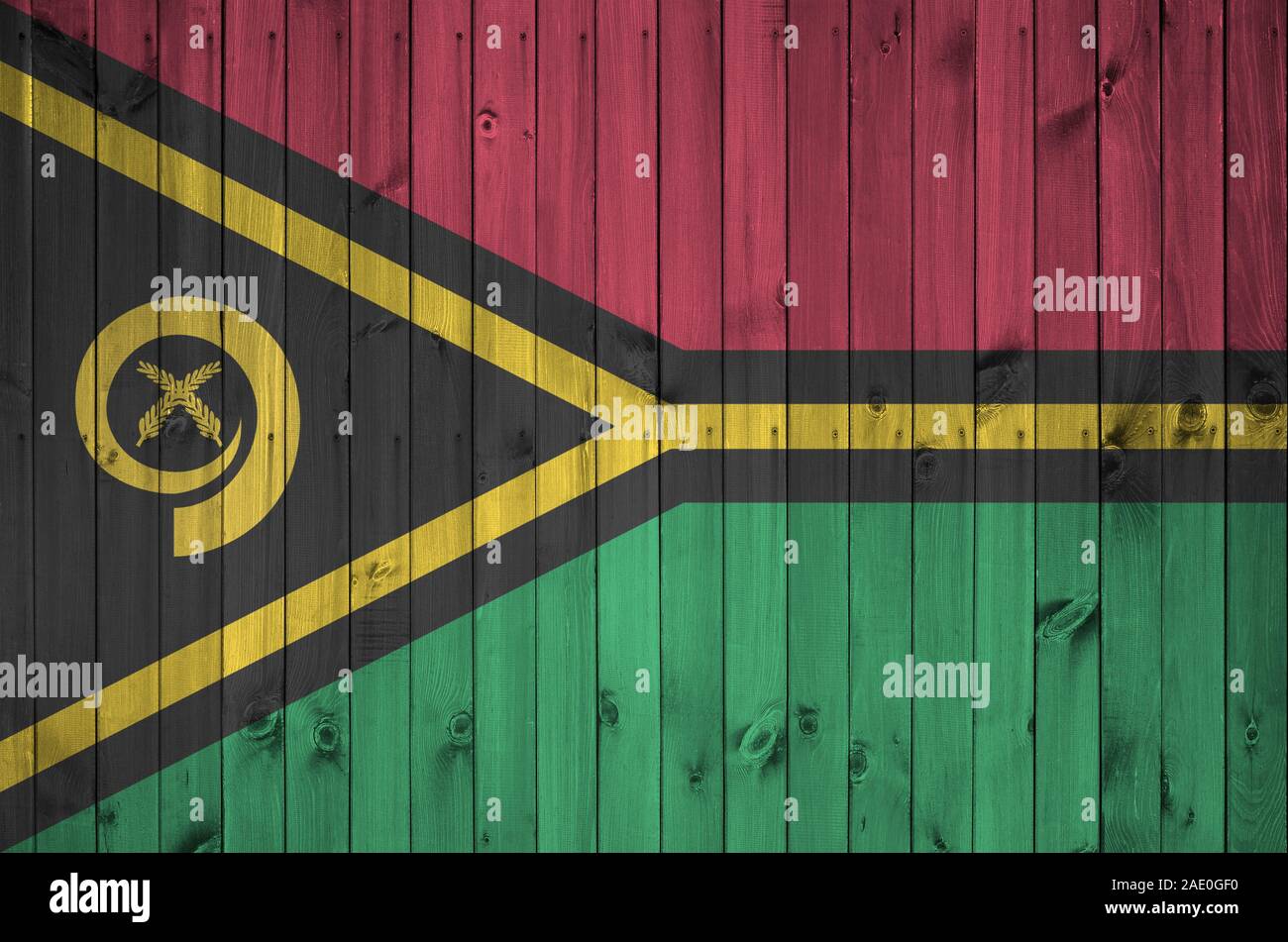 Vanuatu flag depicted in bright paint colors on old wooden wall close ...