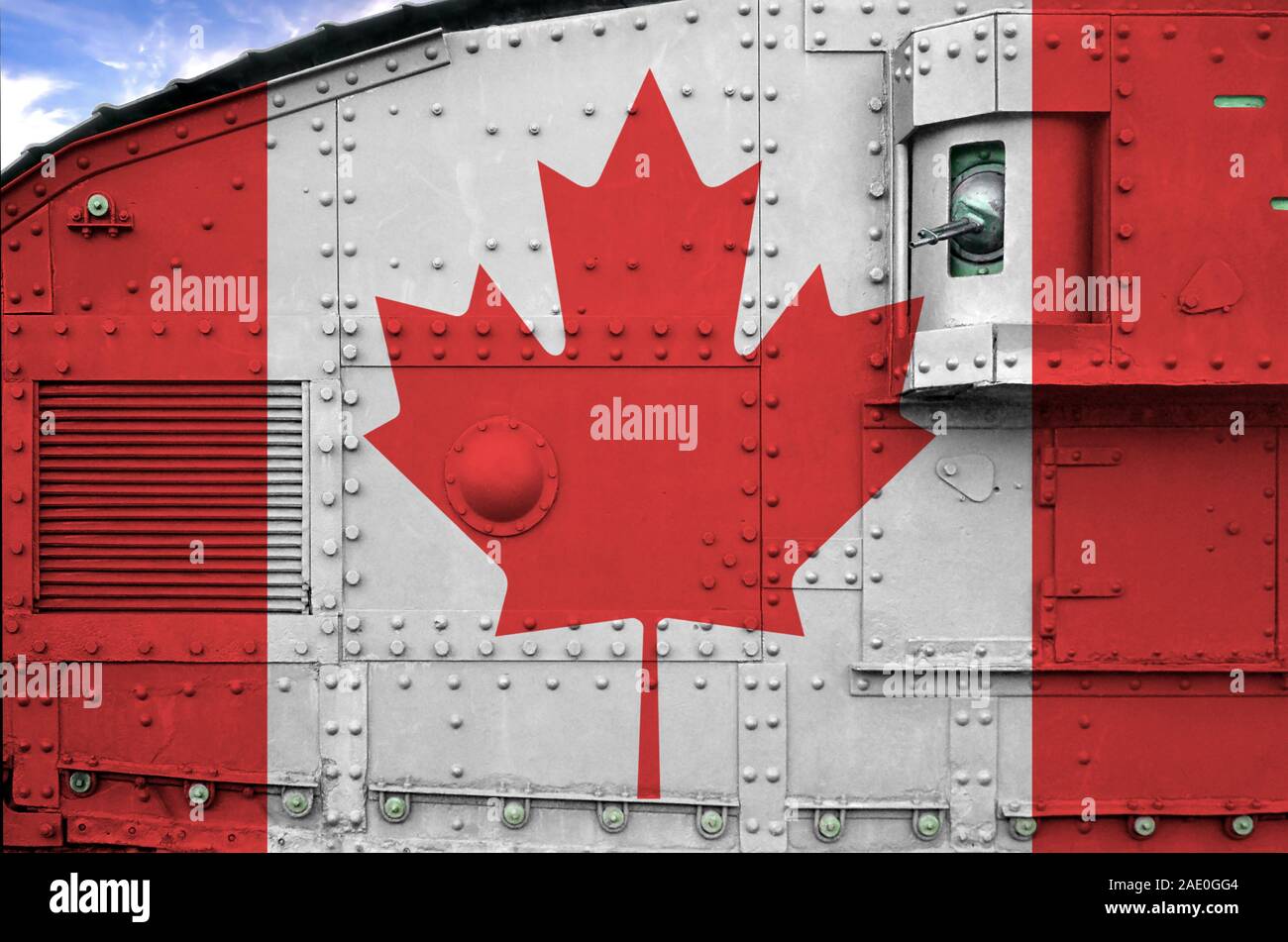 Canada flag depicted on side part of military armored tank close up ...