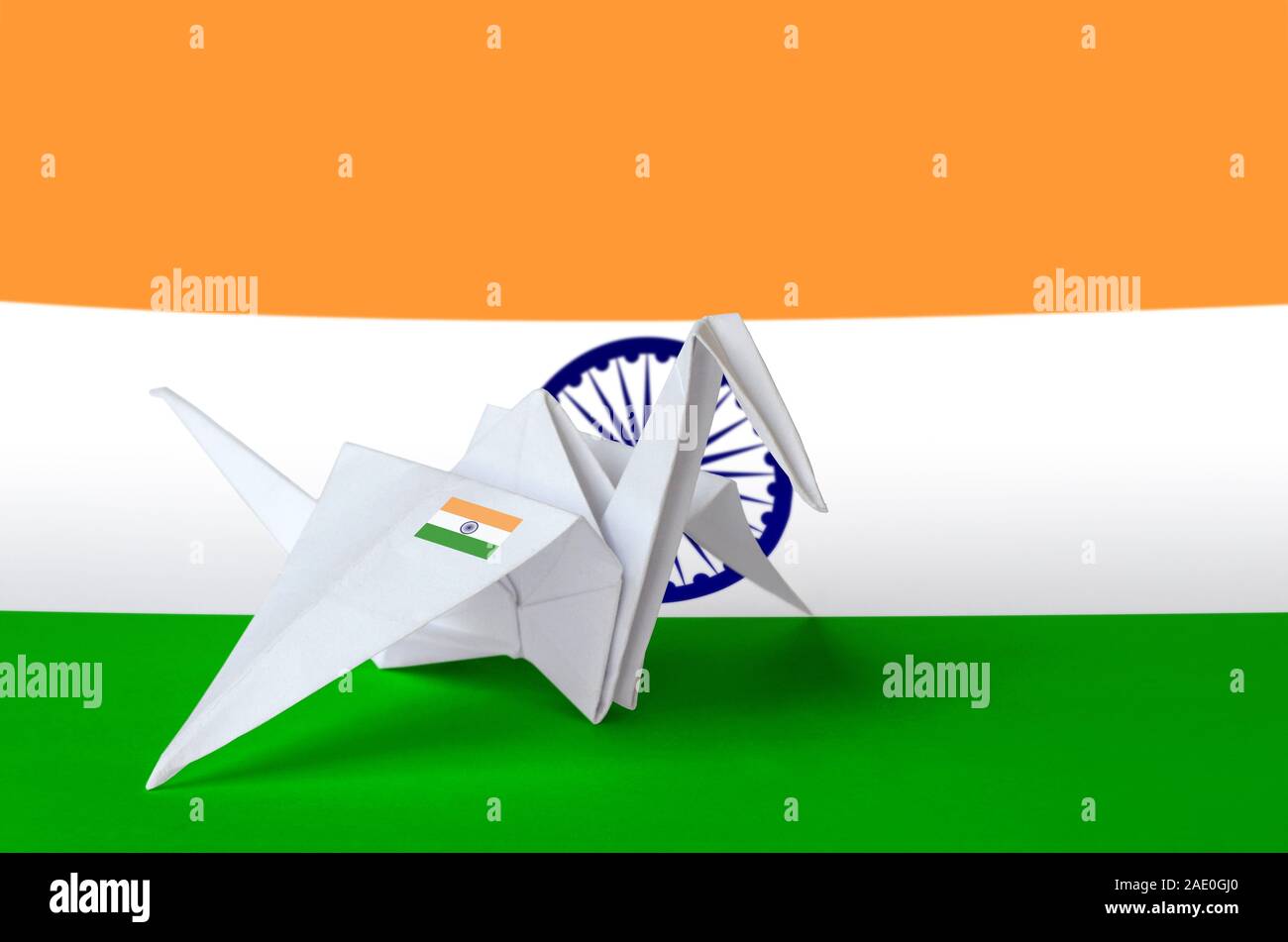 India flag depicted on paper origami crane wing. Oriental handmade arts ...