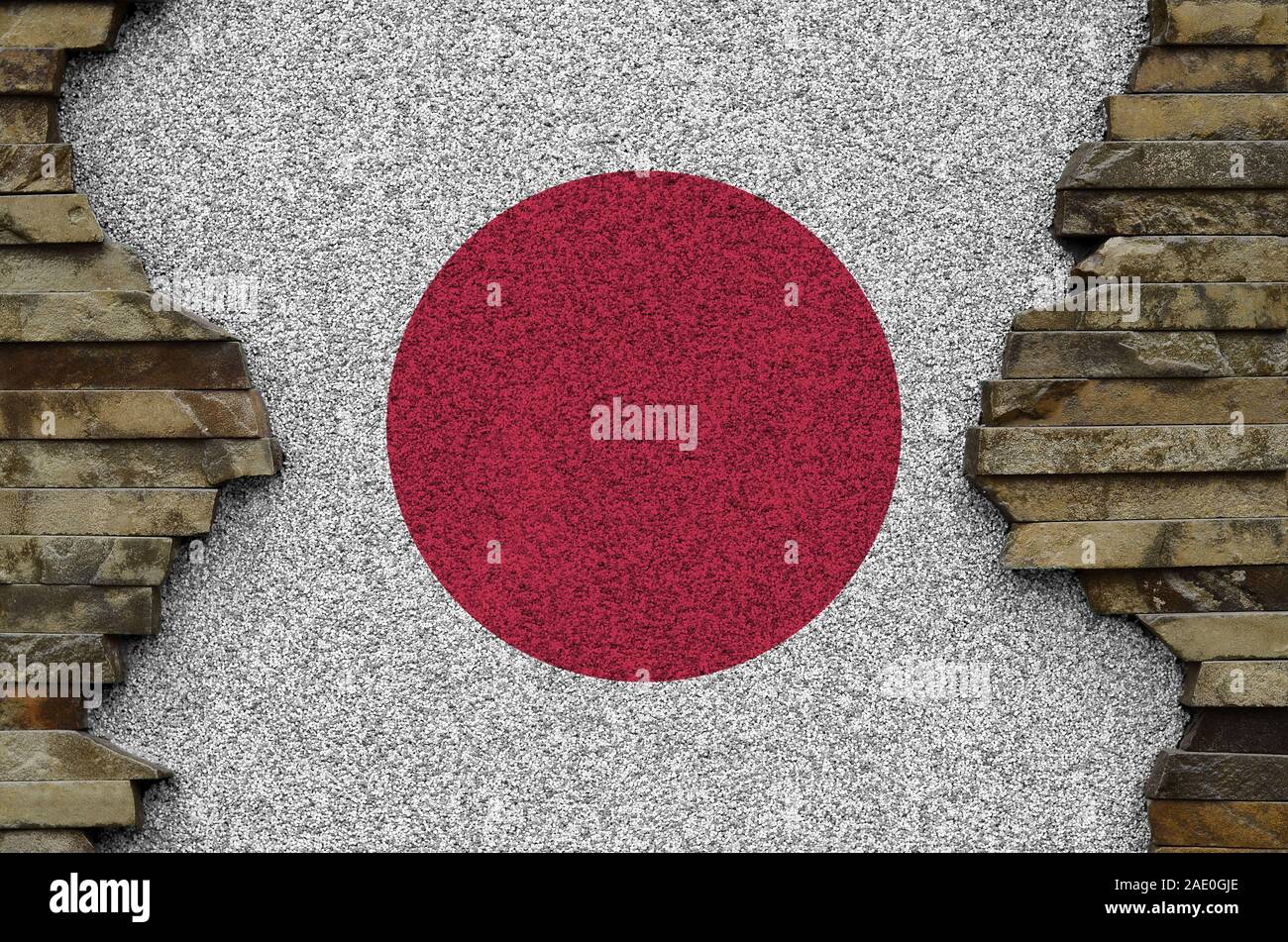 Japan flag depicted in paint colors on old stone wall close up ...