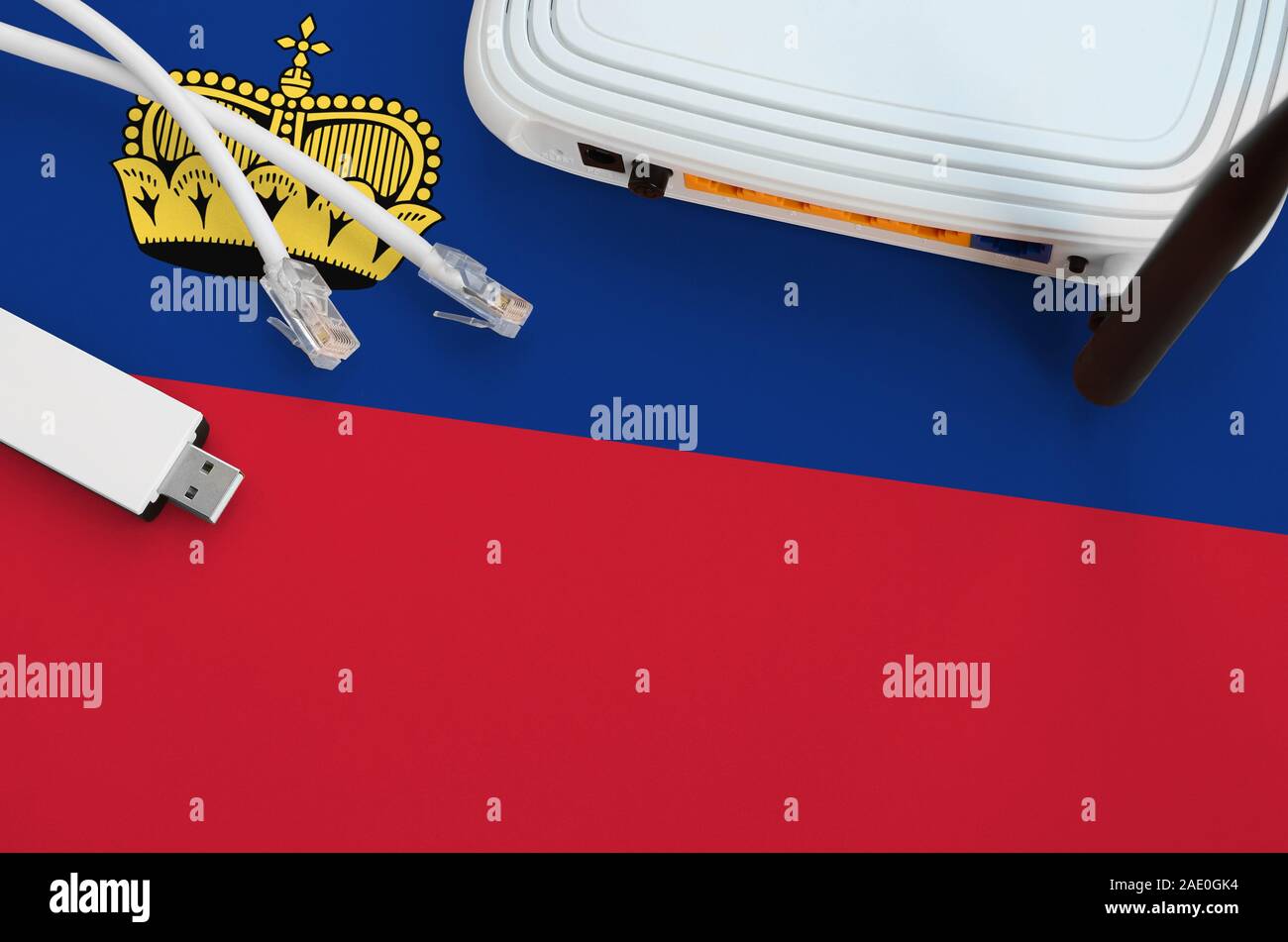 Liechtenstein flag depicted on table with internet rj45 cable, wireless ...