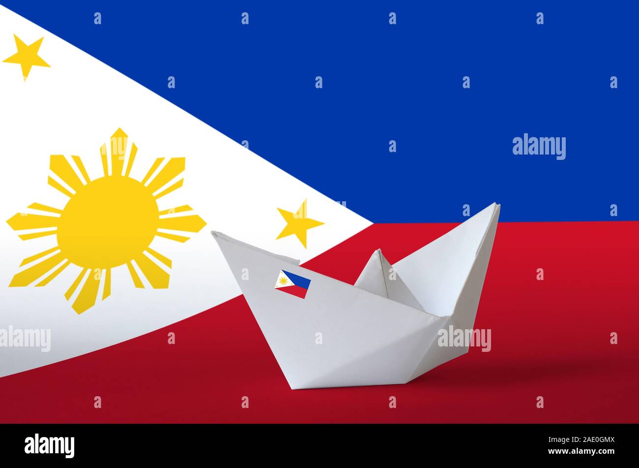 Philippines flag depicted on paper origami ship closeup. Oriental ...