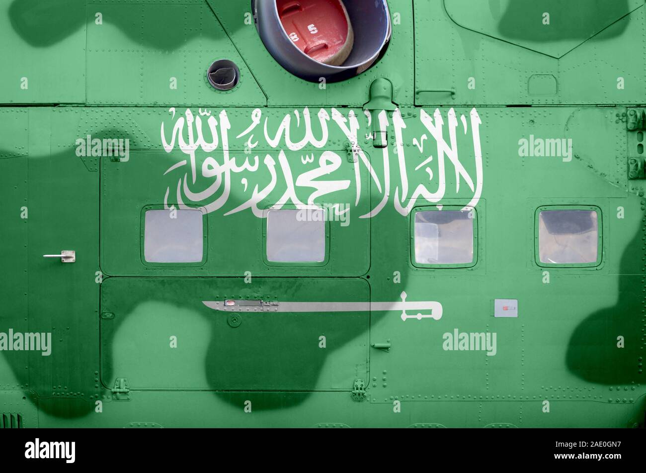 Saudi Arabia flag depicted on side part of military armored helicopter ...