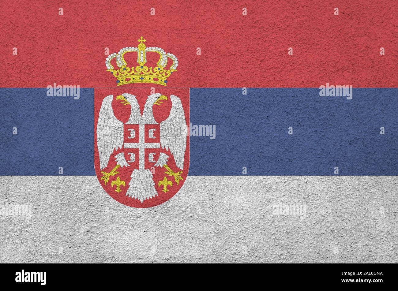 Serbia flag depicted in bright paint colors on old relief plastering ...
