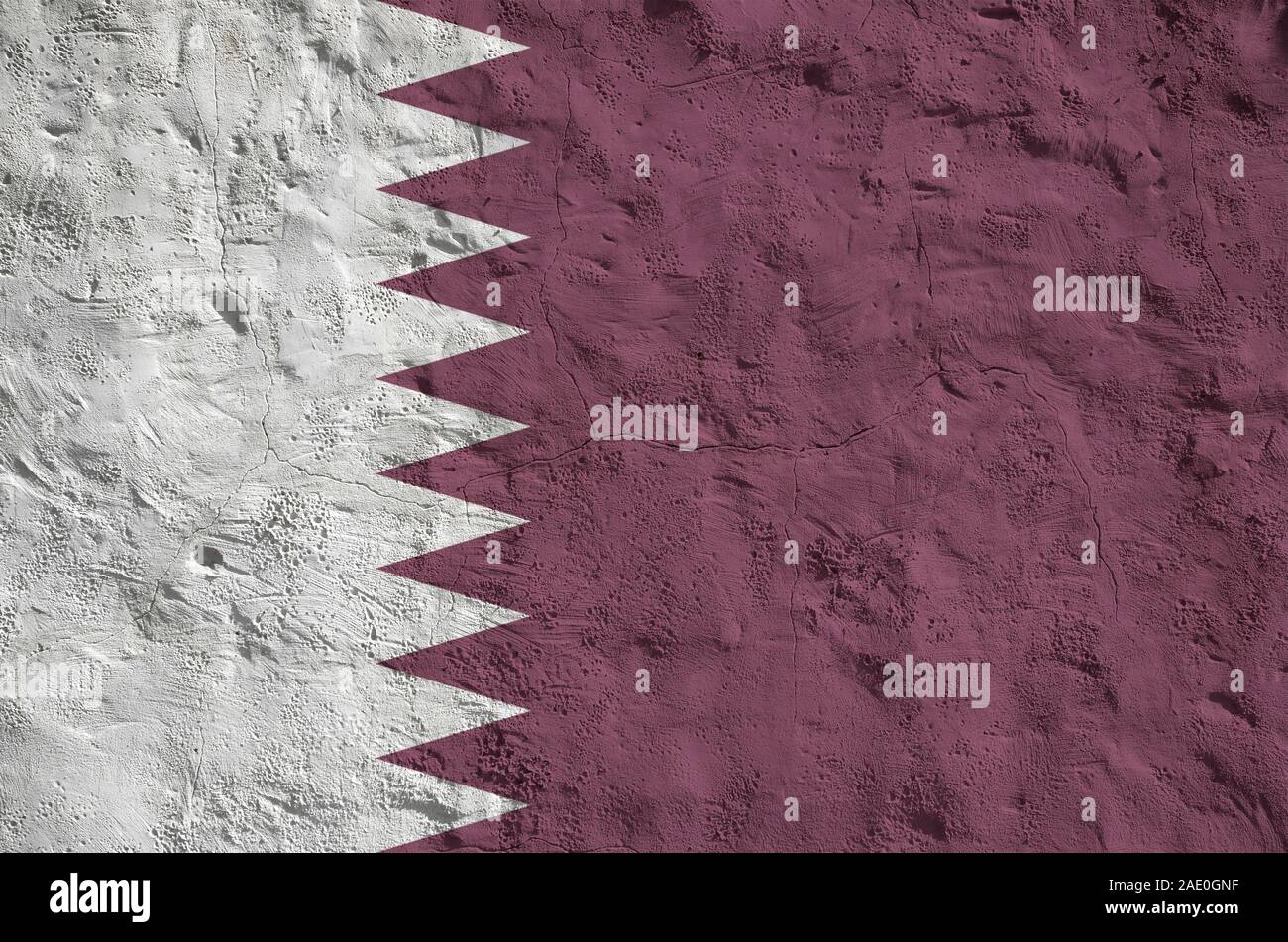 Qatar flag depicted in bright paint colors on old relief plastering ...