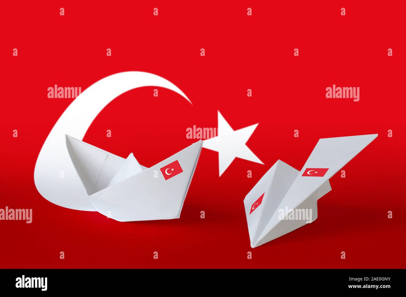 Turkey flag depicted on paper origami airplane and boat. Oriental ...