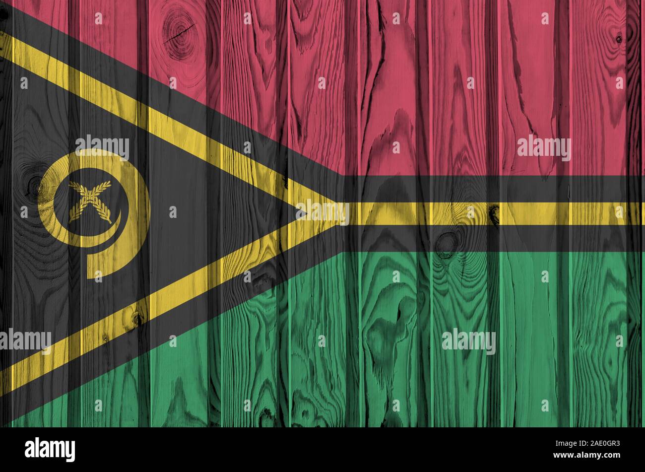 Vanuatu flag depicted in bright paint colors on old wooden wall close ...