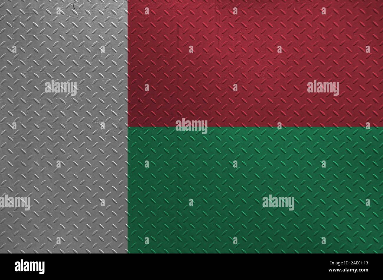 Madagascar flag depicted in paint colors on old brushed metal plate or ...