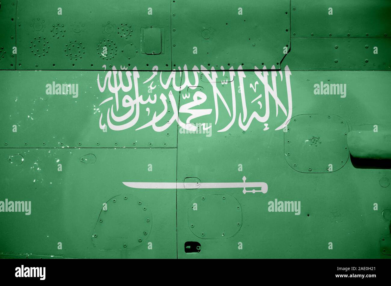 Saudi Arabia flag depicted on side part of military armored helicopter ...
