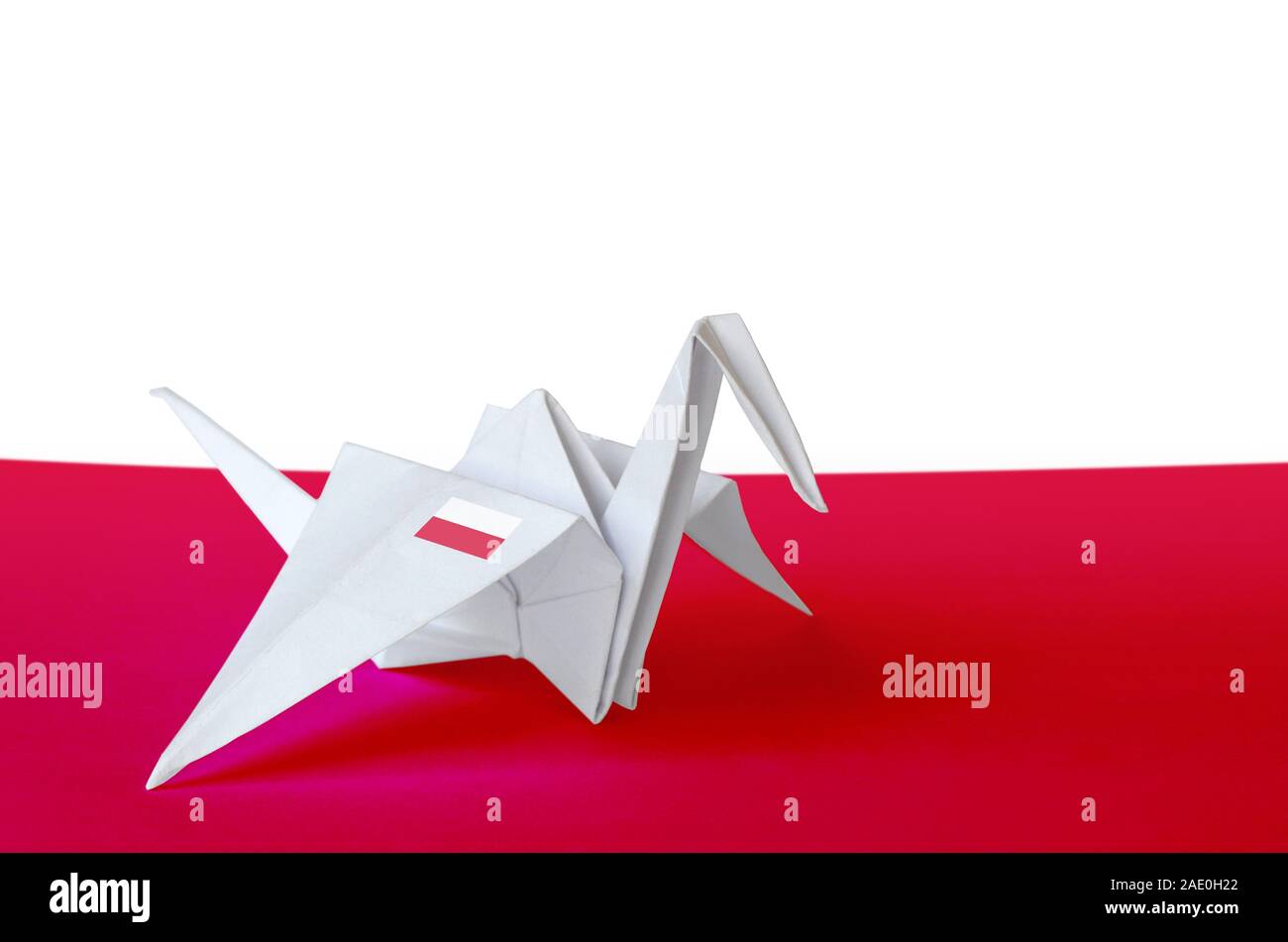 Poland flag depicted on paper origami crane wing. Oriental handmade ...
