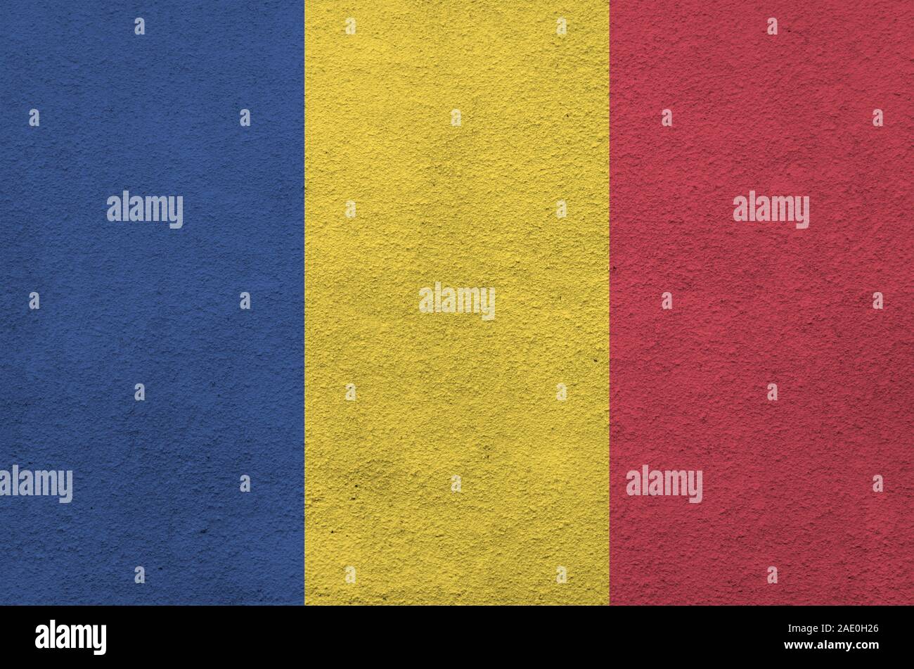 Romania flag depicted in bright paint colors on old relief plastering ...