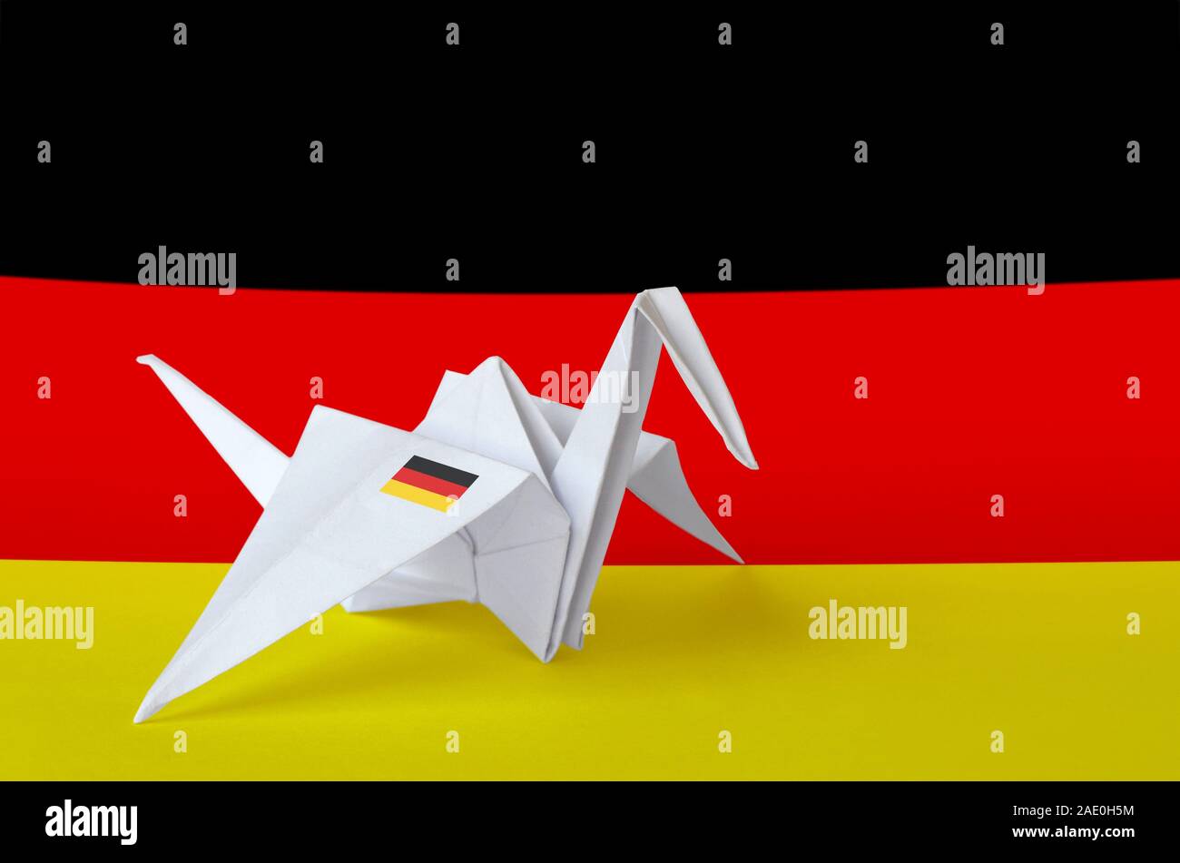 Germany flag depicted on paper origami crane wing. Oriental handmade ...