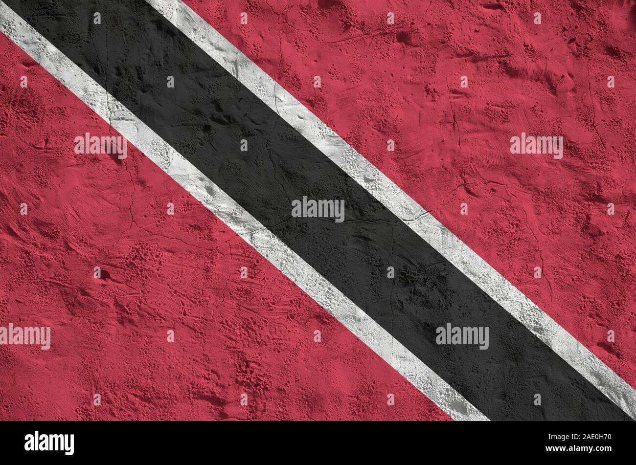 Trinidad and Tobago flag depicted in bright paint colors on old relief ...