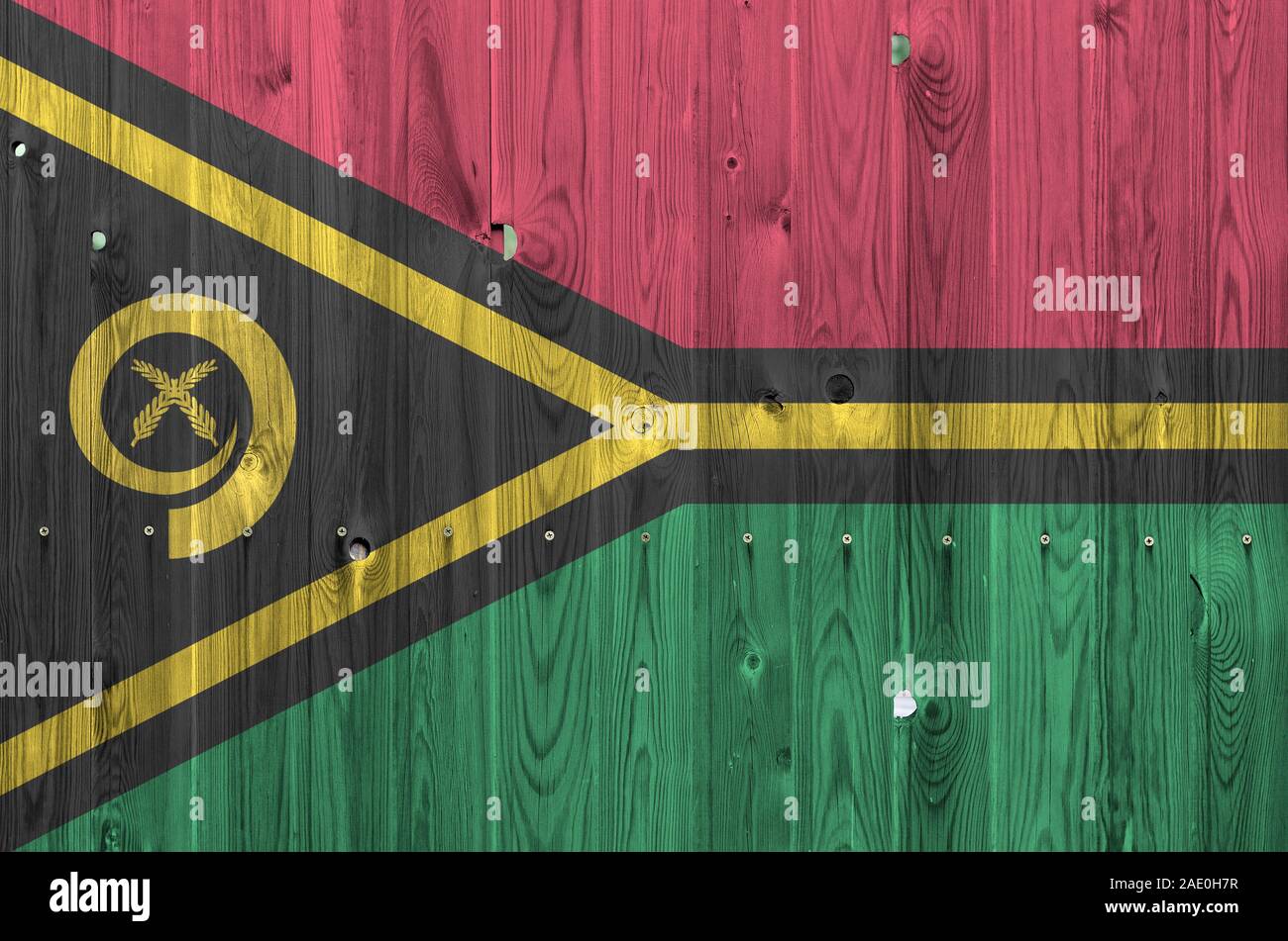 Vanuatu flag depicted in bright paint colors on old wooden wall close ...