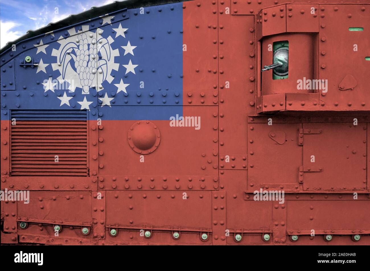 Myanmar flag depicted on side part of military armored tank close up ...