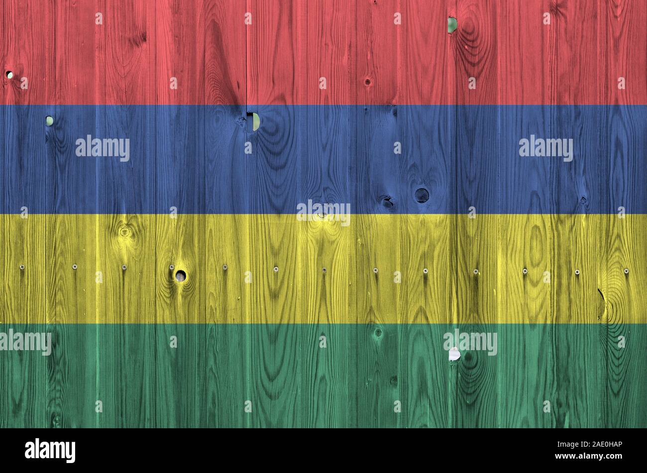 Mauritius flag depicted in bright paint colors on old wooden wall close ...