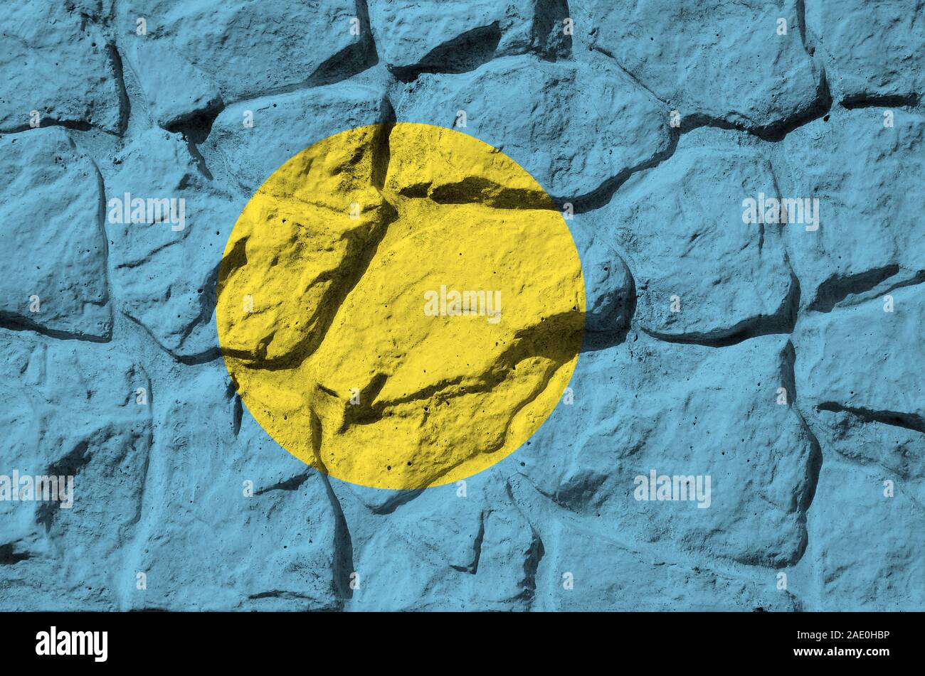 Palau flag depicted in paint colors on old stone wall close up ...