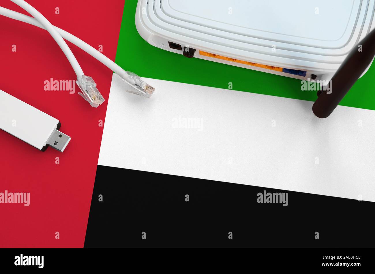 United Arab Emirates flag depicted on table with internet rj45 cable ...