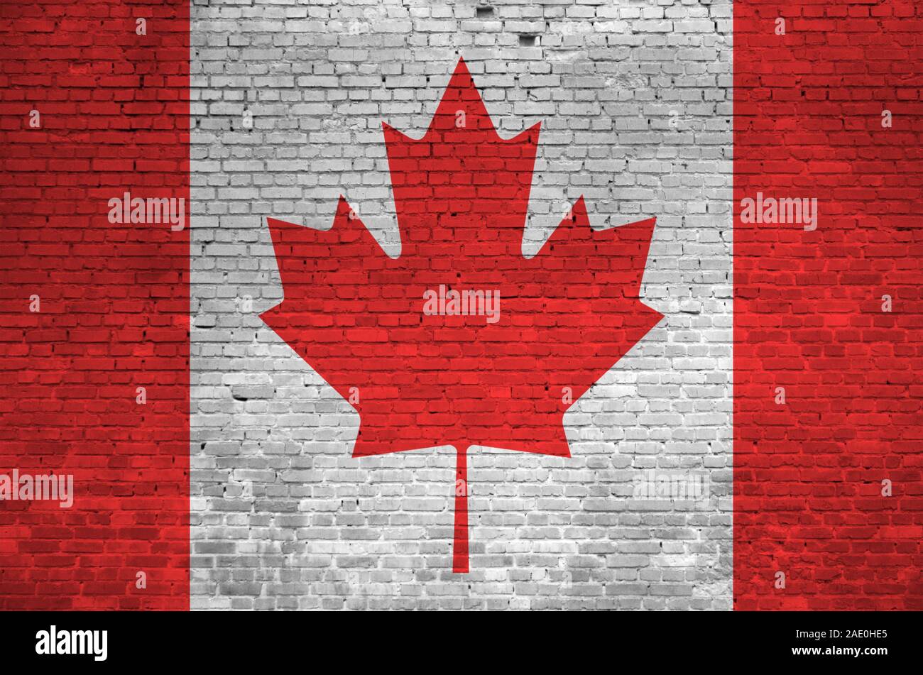 Canada flag depicted in paint colors on old brick wall close up ...