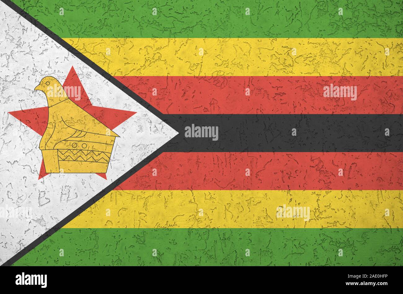 Zimbabwe flag depicted in bright paint colors on old relief plastering ...