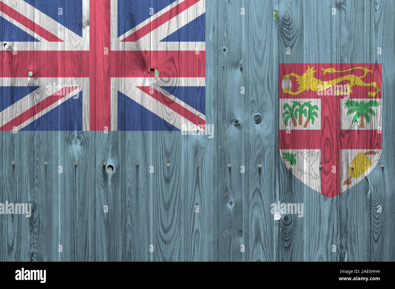 Fiji flag depicted in bright paint colors on old wooden wall close up ...