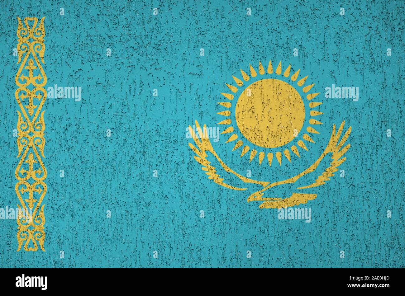 Kazakhstan flag depicted in bright paint colors on old relief ...