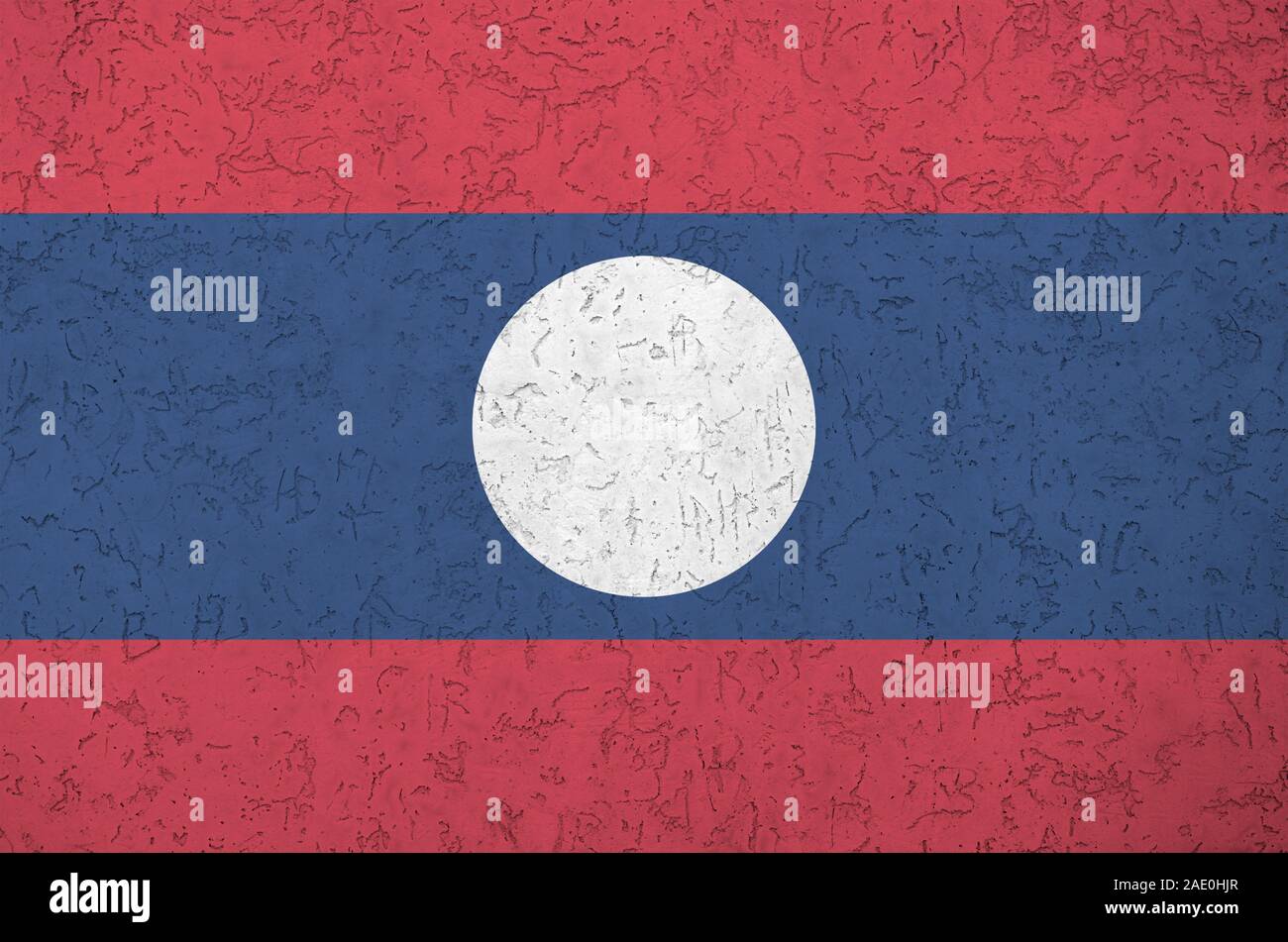 Laos flag depicted in bright paint colors on old relief plastering wall ...