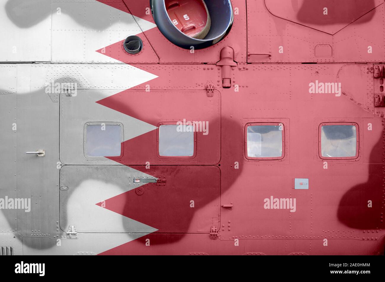 Bahrain flag depicted on side part of military armored helicopter close ...