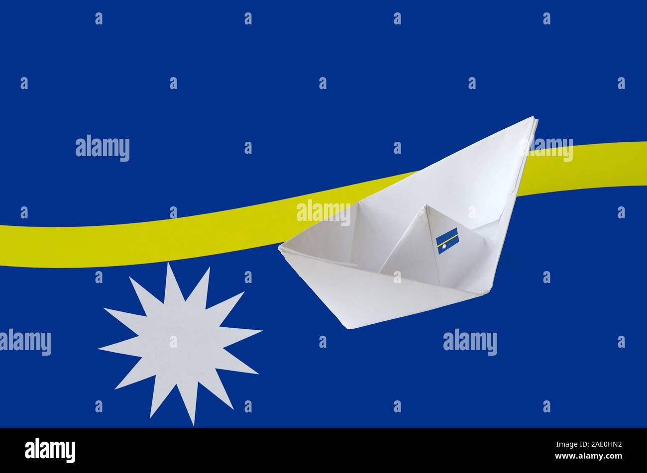 Nauru flag depicted on paper origami ship closeup. Oriental handmade ...