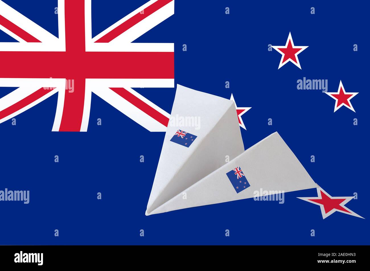 New Zealand flag depicted on paper origami airplane. Oriental handmade ...