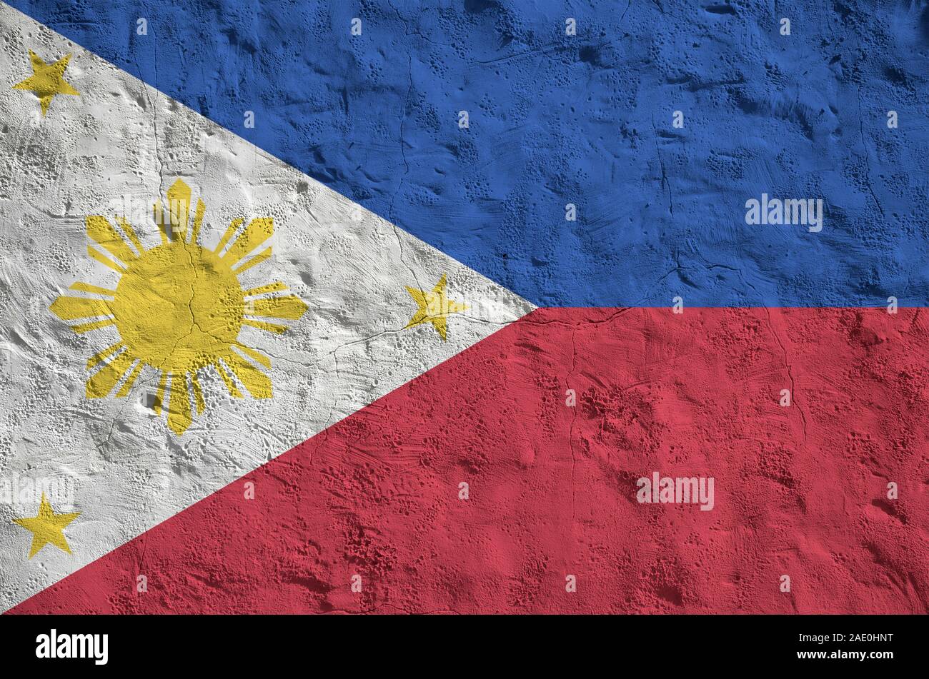 Philippines flag depicted in bright paint colors on old relief ...