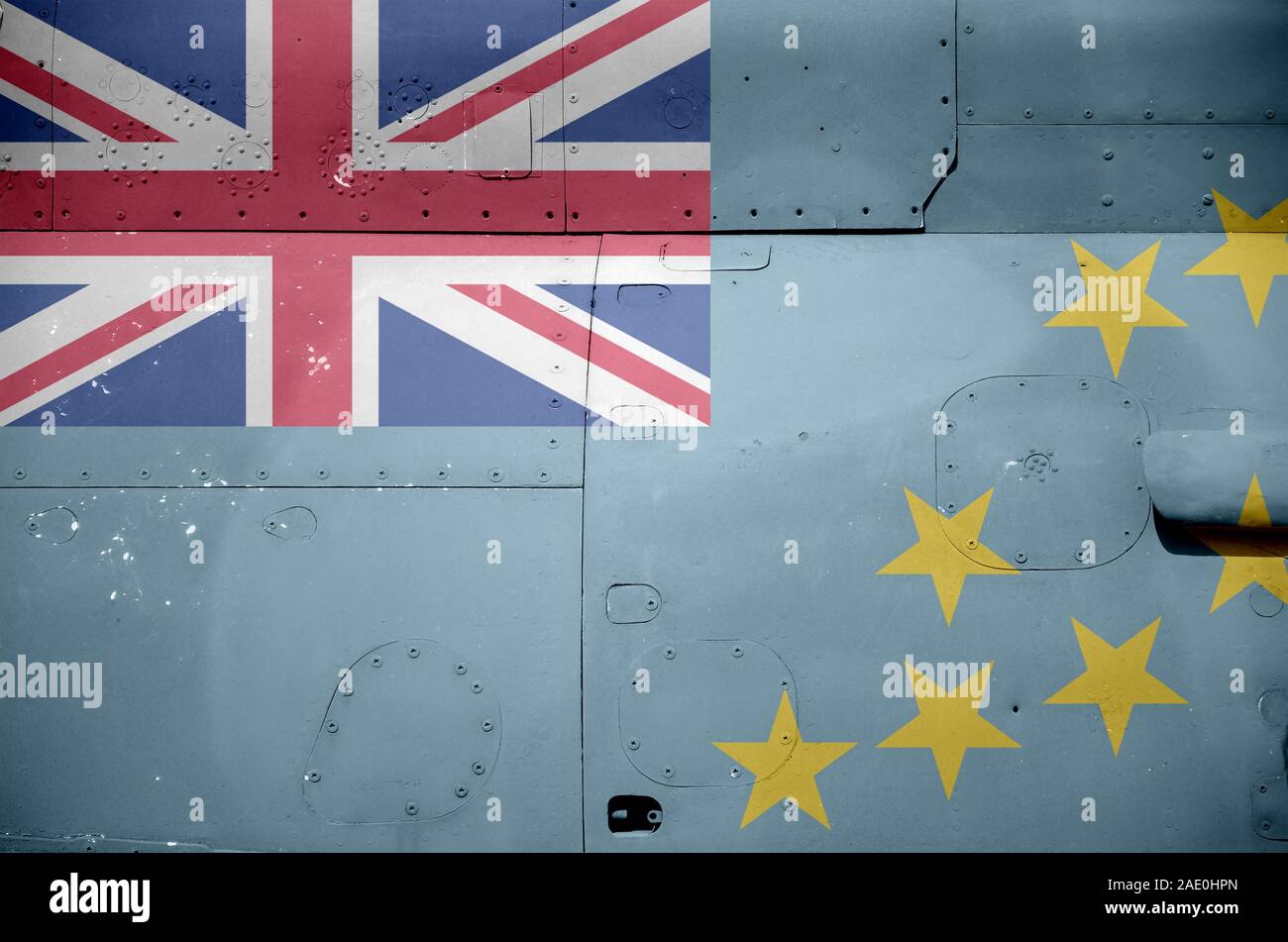 Tuvalu flag depicted on side part of military armored helicopter close ...