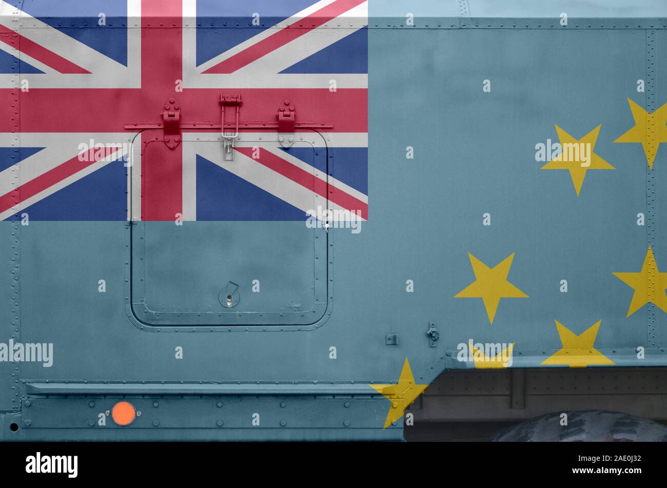 Tuvalu flag depicted on side part of military armored truck close up ...