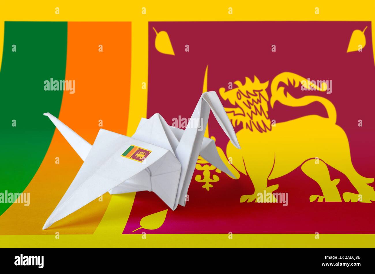 Sri Lanka flag depicted on paper origami crane wing. Oriental handmade ...